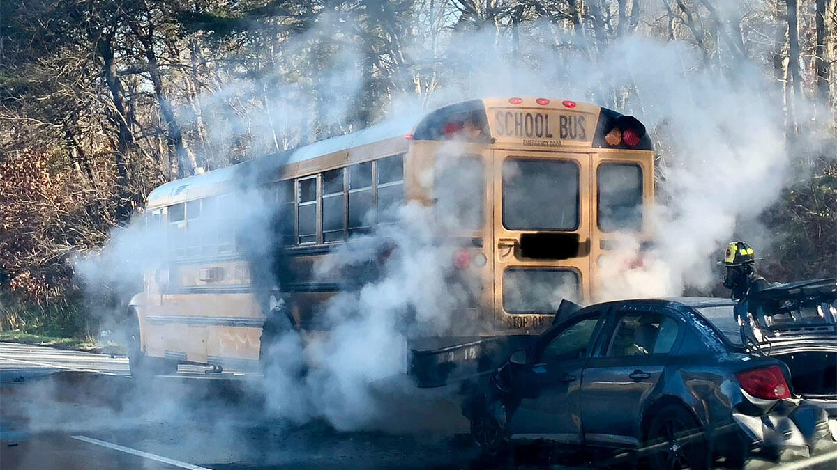 WATCH: Bystanders Rescue Driver Involved In Fiery School Bus Crash | iHeart