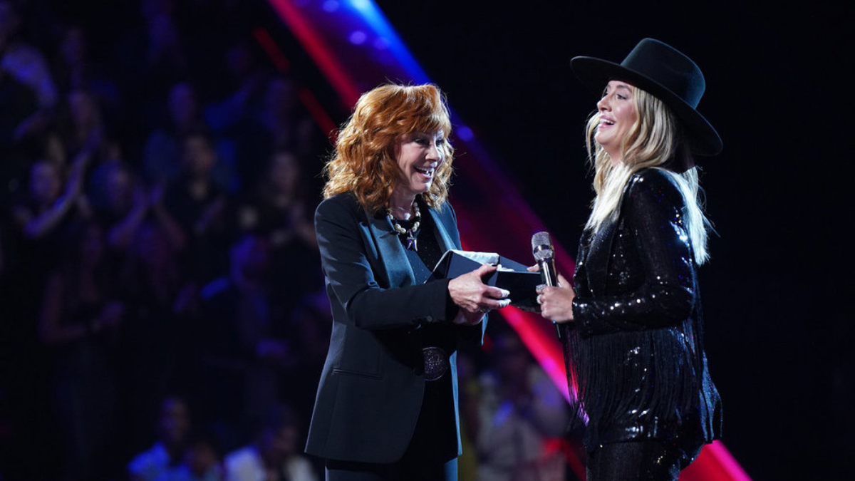Watch Reba McEntire Surprise Lainey Wilson With Grand Ole Opry Invitation | iHeart